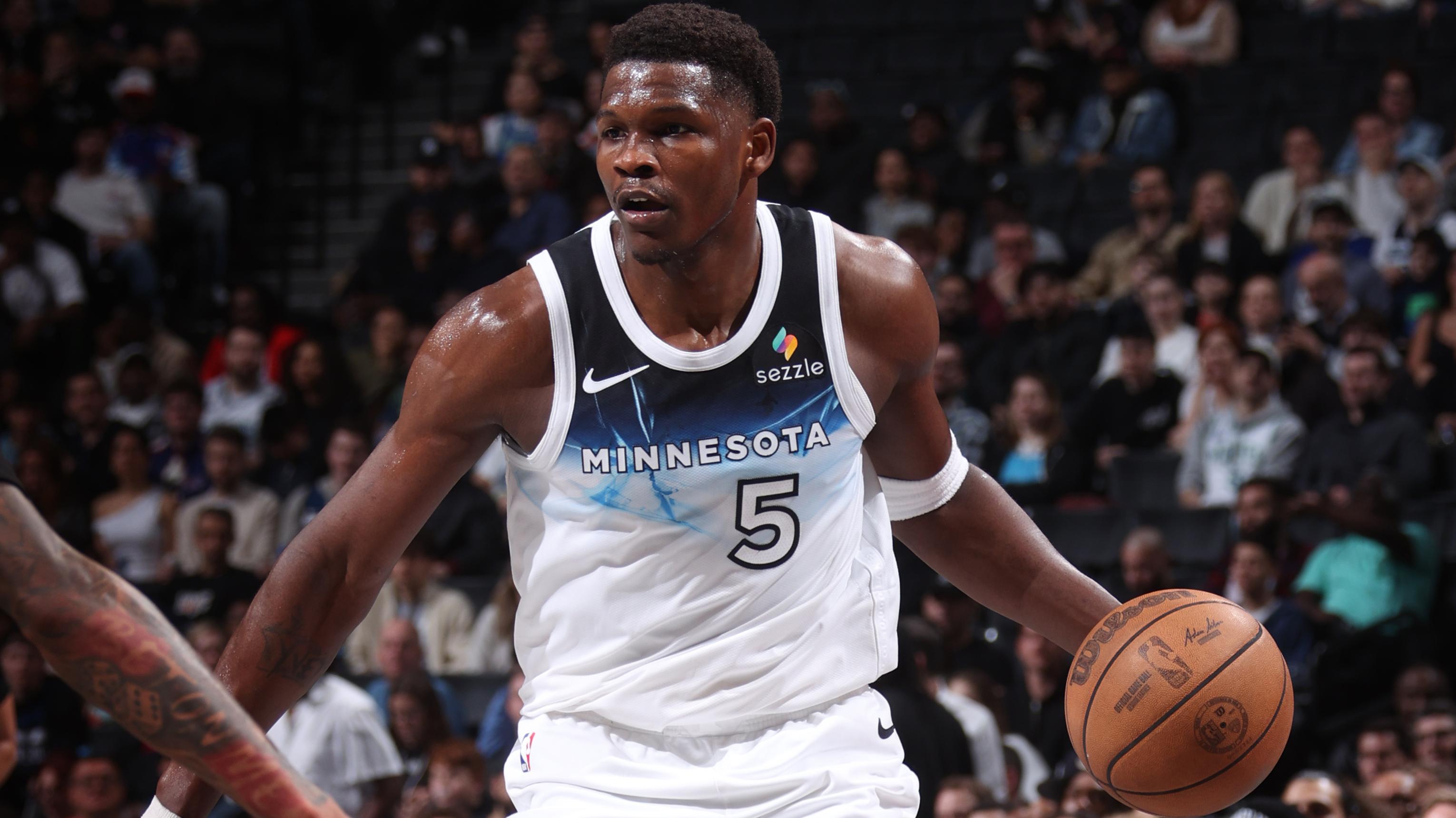 Wolves' Anthony Edwards Suffers Apparent Ankle Injury After Landing on Nets HC's Foot